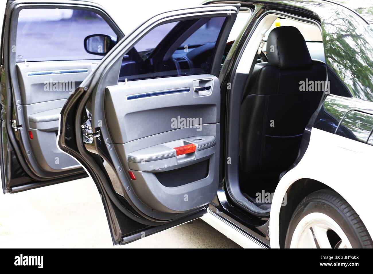 Modern car with open door outdoors Stock Photo - Alamy