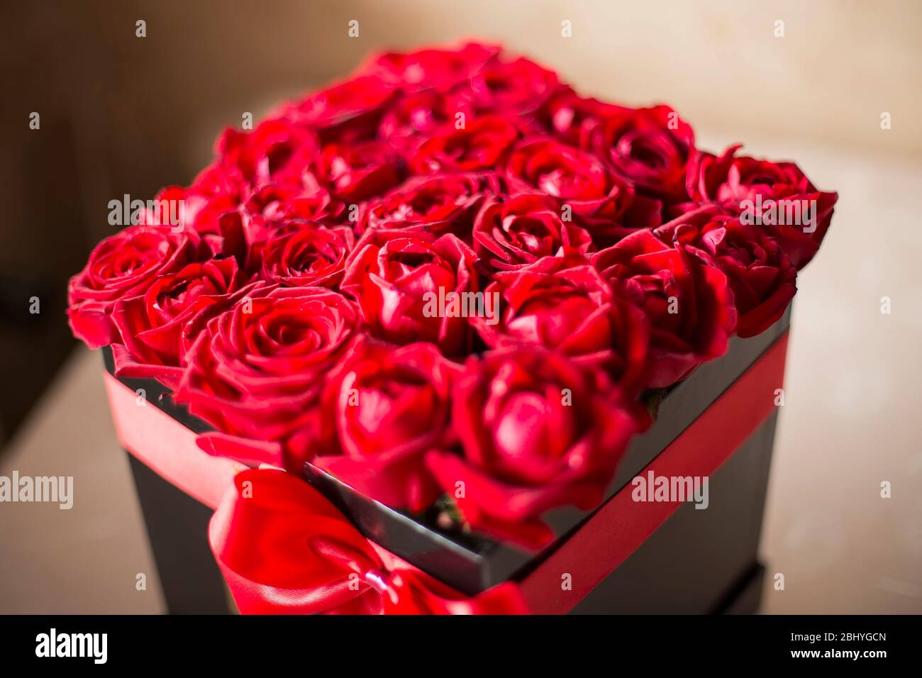 Closeup of the box full of red roses Stock Photo - Alamy