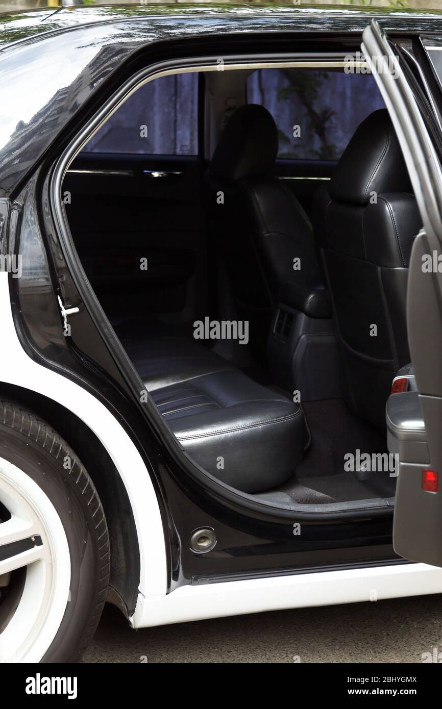 Modern car with open door outdoors Stock Photo - Alamy