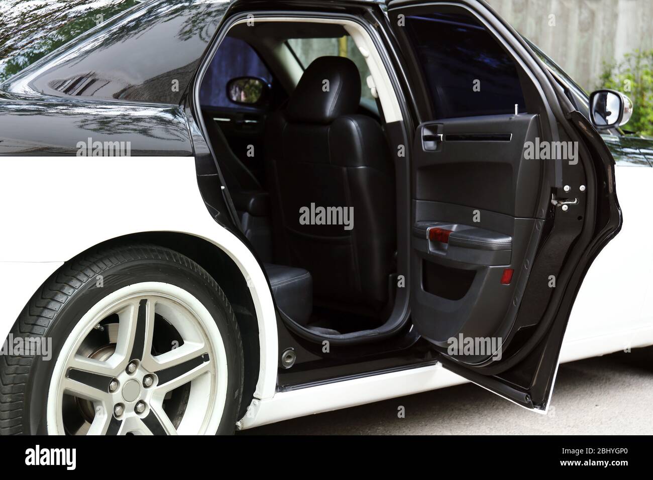 Modern car with open door outdoors Stock Photo - Alamy