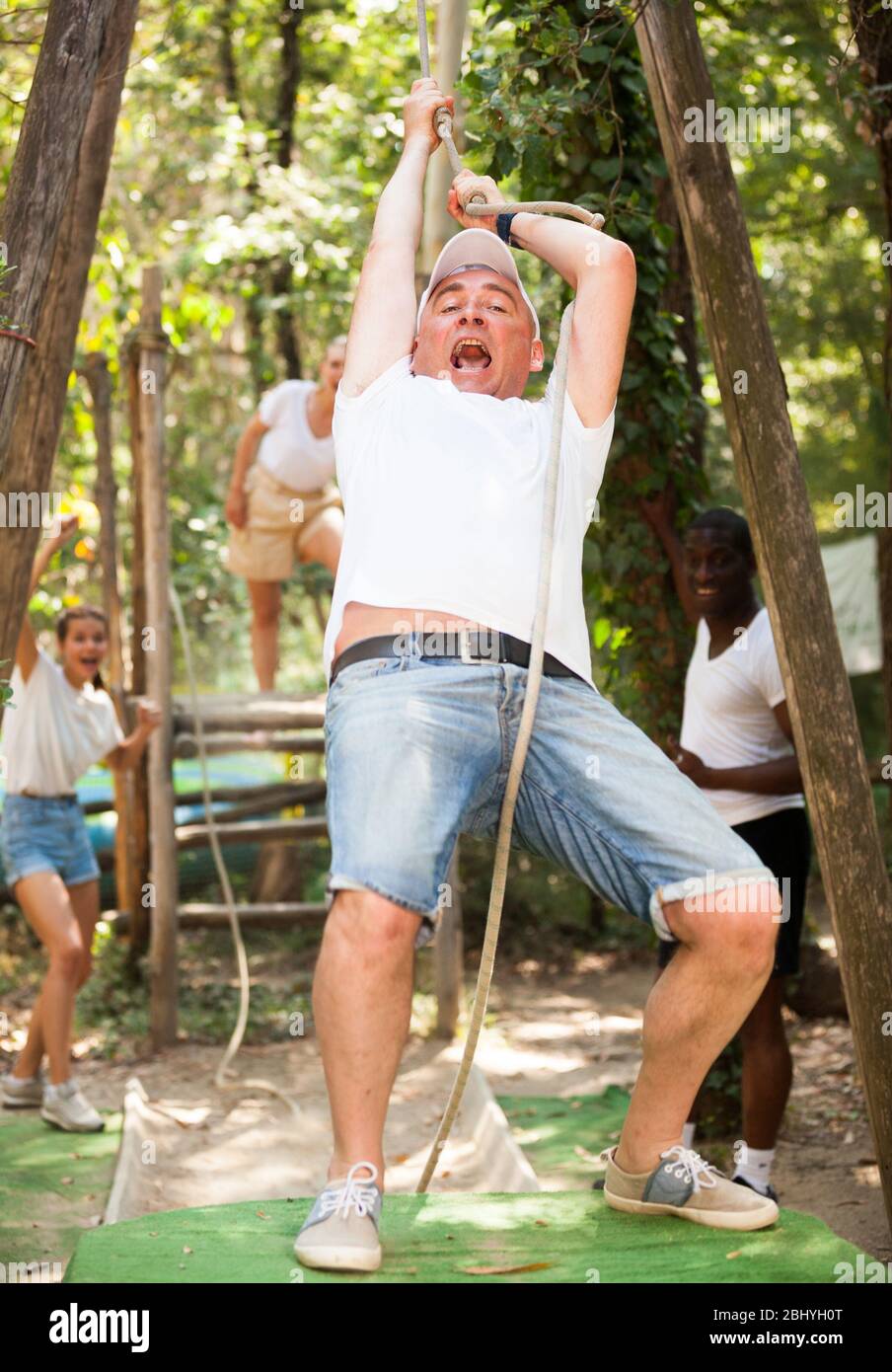 Jumping on the ropes - fun attraction in an amusement park Stock Photo ...