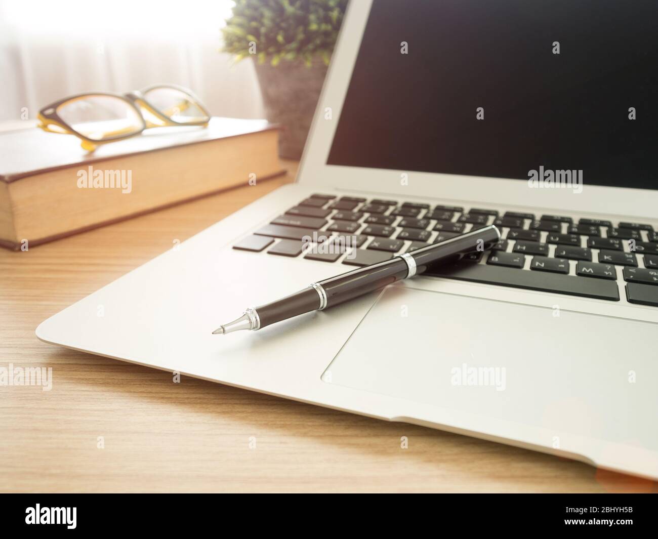Pen and Laptop computer on desk's journalist in the home - freelance or ...