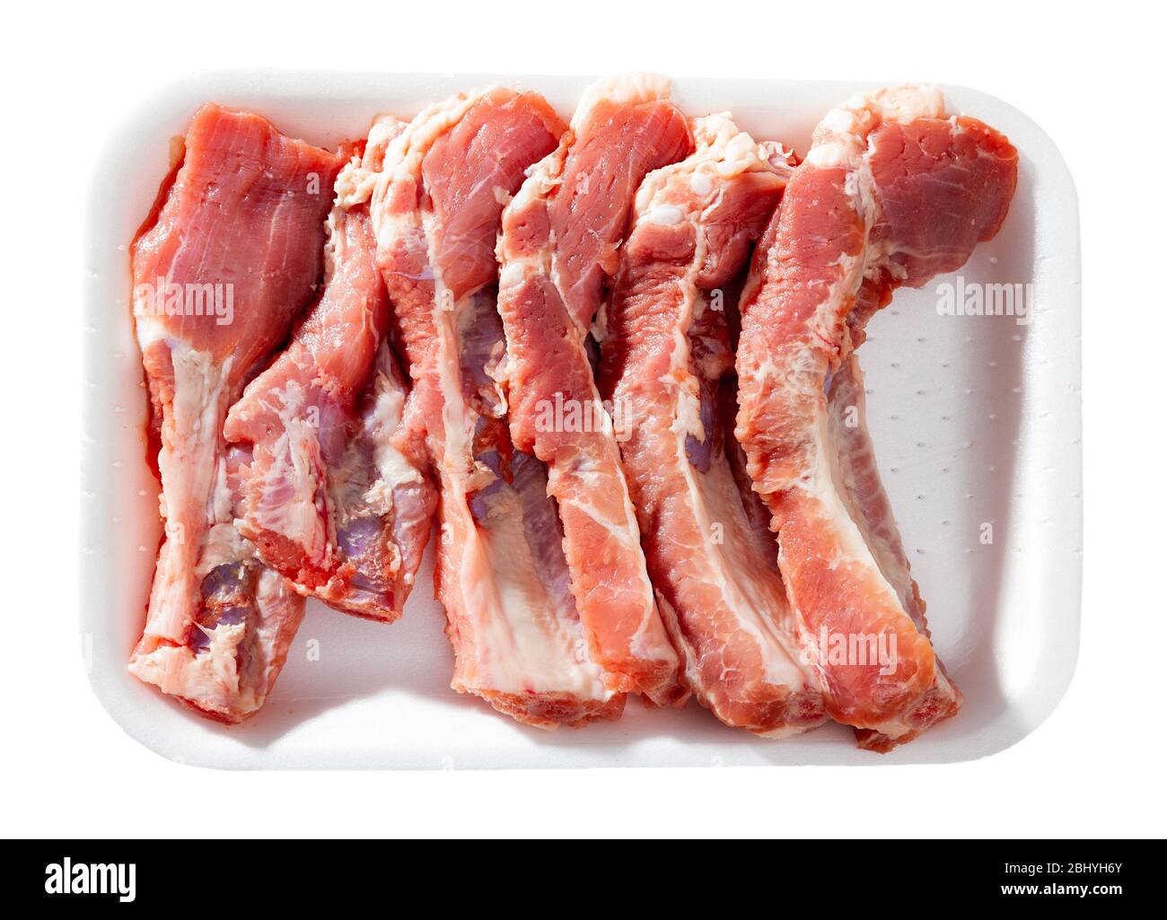Uncooked pork ribs rack. Isolated over white background Stock Photo - Alamy