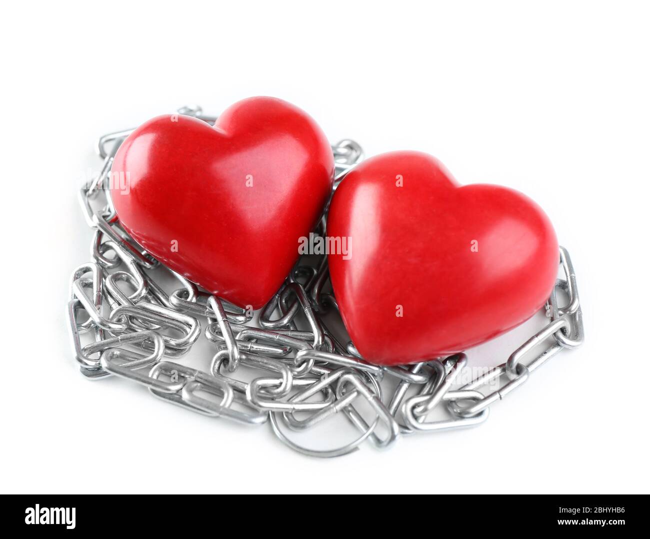 Two hearts with metal chain isolated on white Stock Photo - Alamy