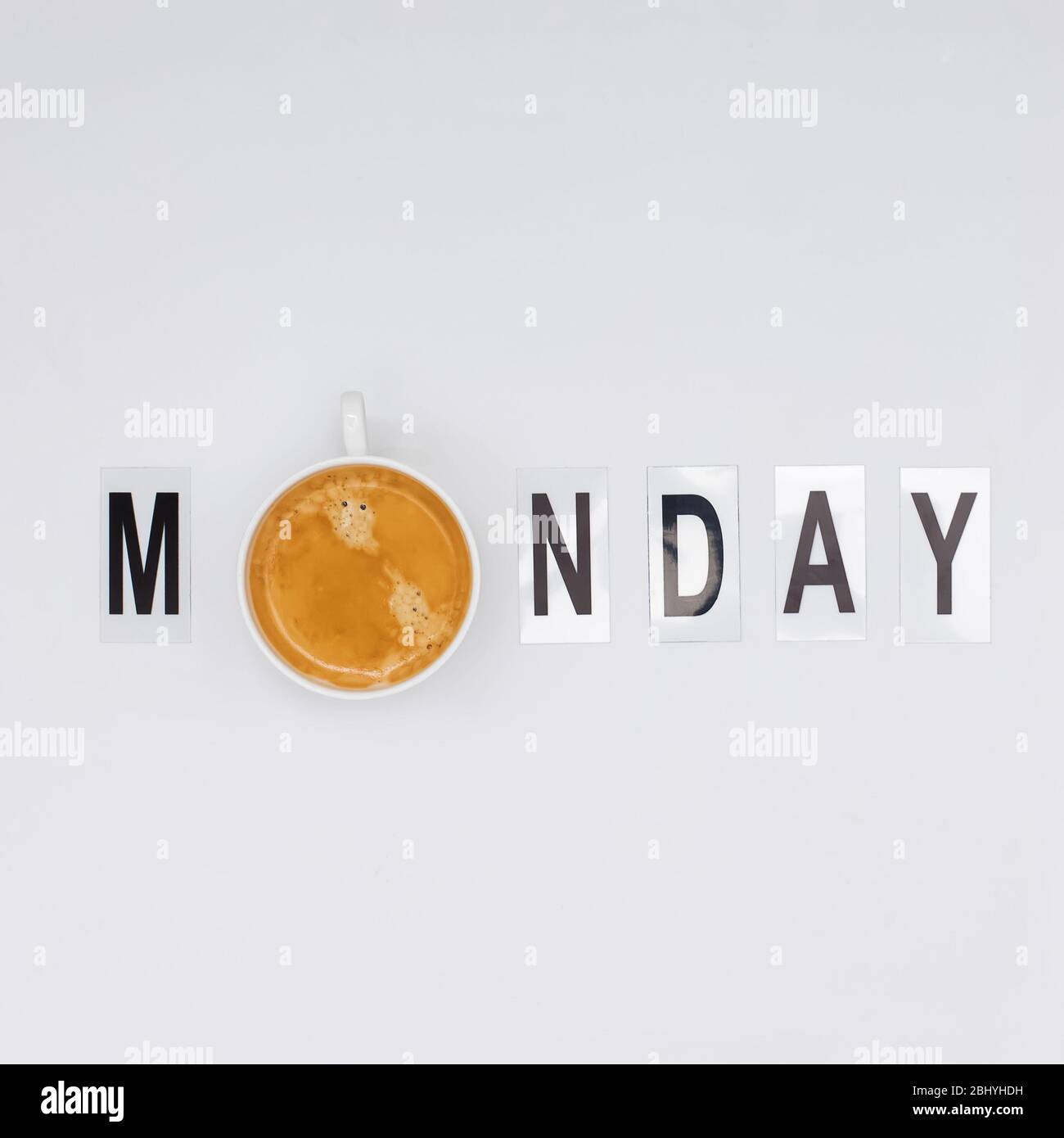 Cup of coffee as letter O in word Monday arranged from print letters ...