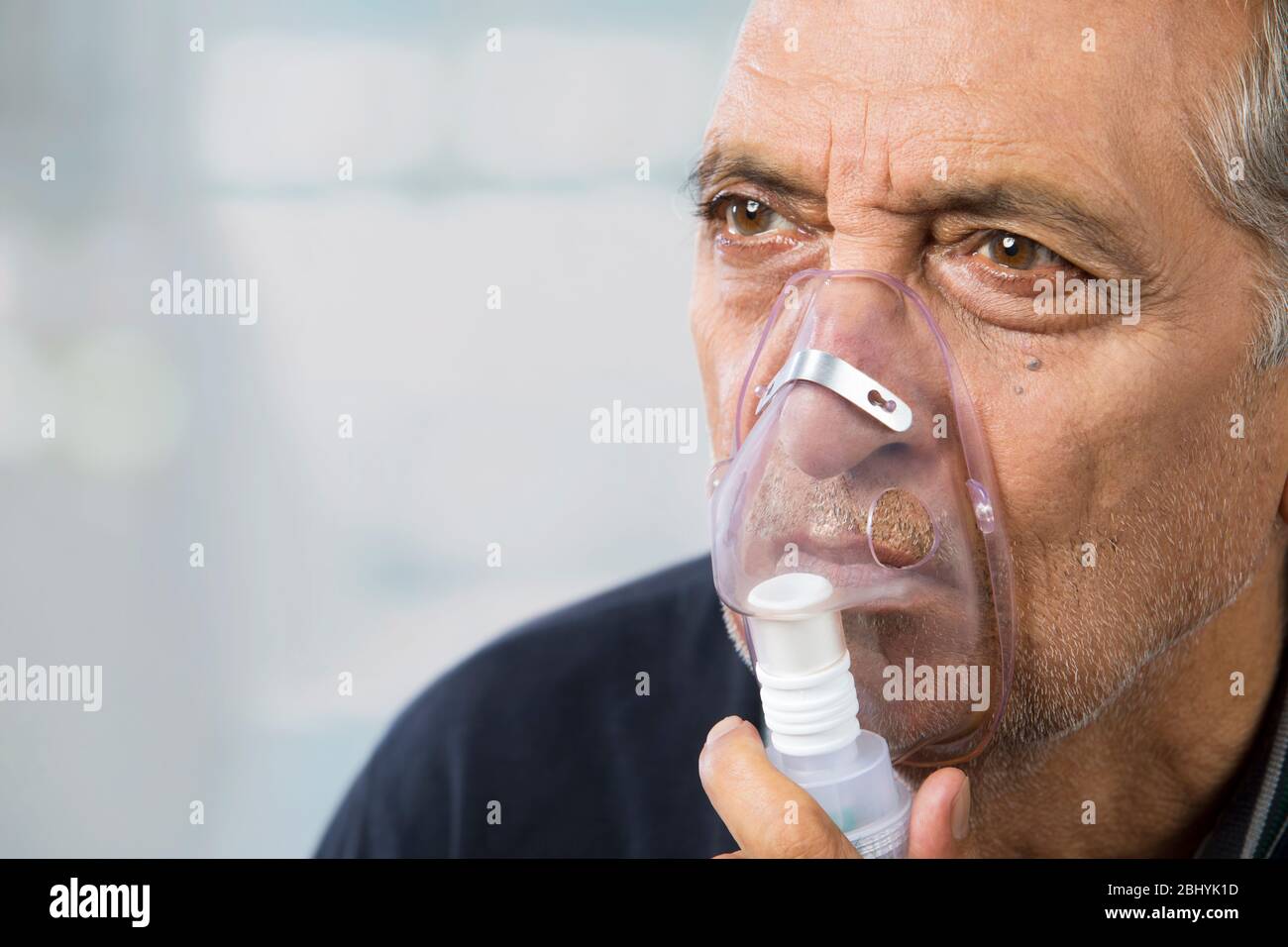 Portrait of a senior man wearing an oxygen mask. (Health and Fitness ...