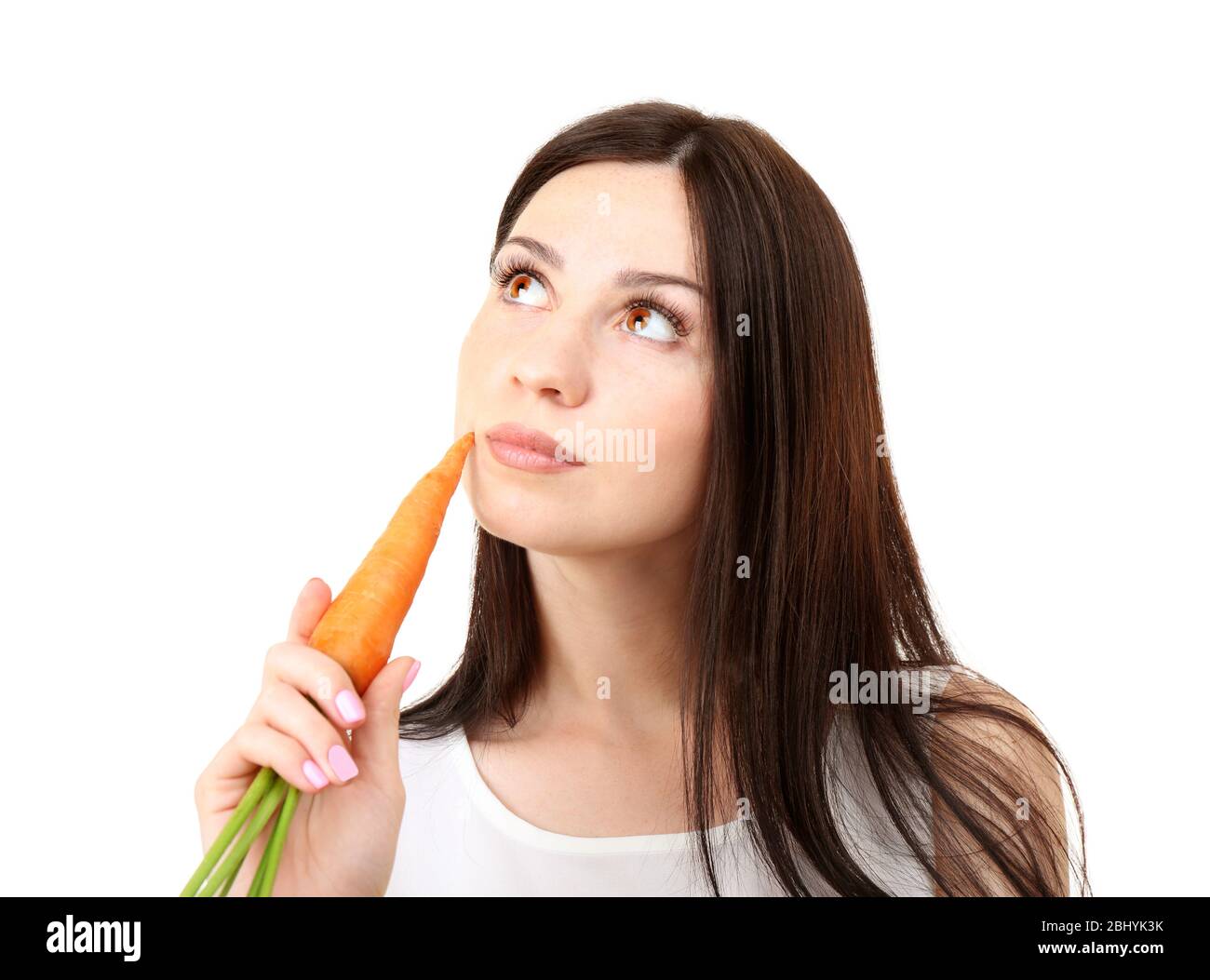 Young woman eating carrot hi-res stock photography and images - Alamy