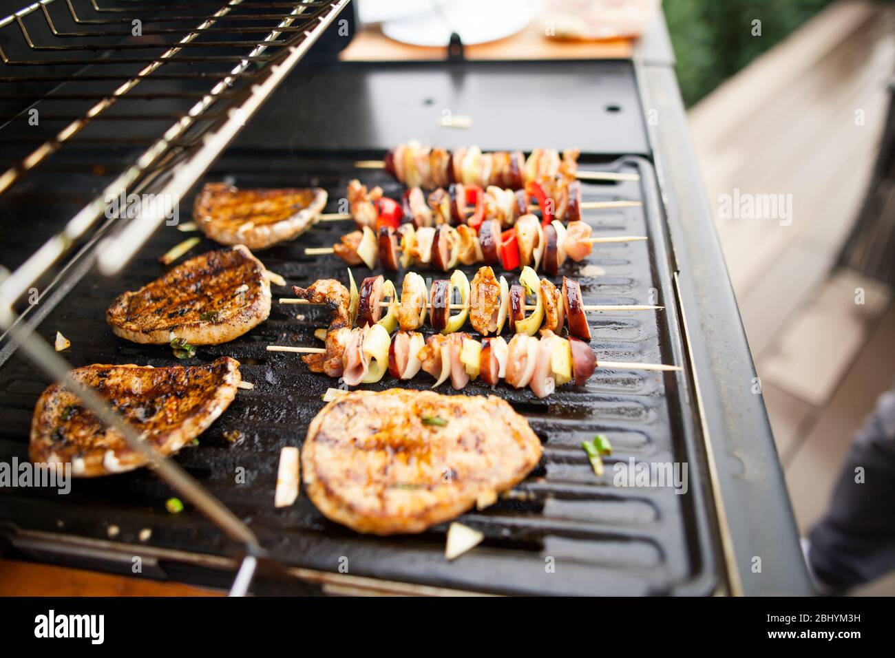 Grilled fresh meat and vegetable on the gas grill, ready to eat, food ...