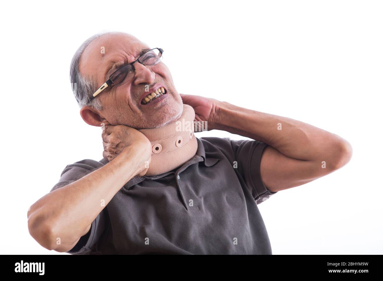 Senior man having a neck pain wearing a neck band. (Health and fitness ...