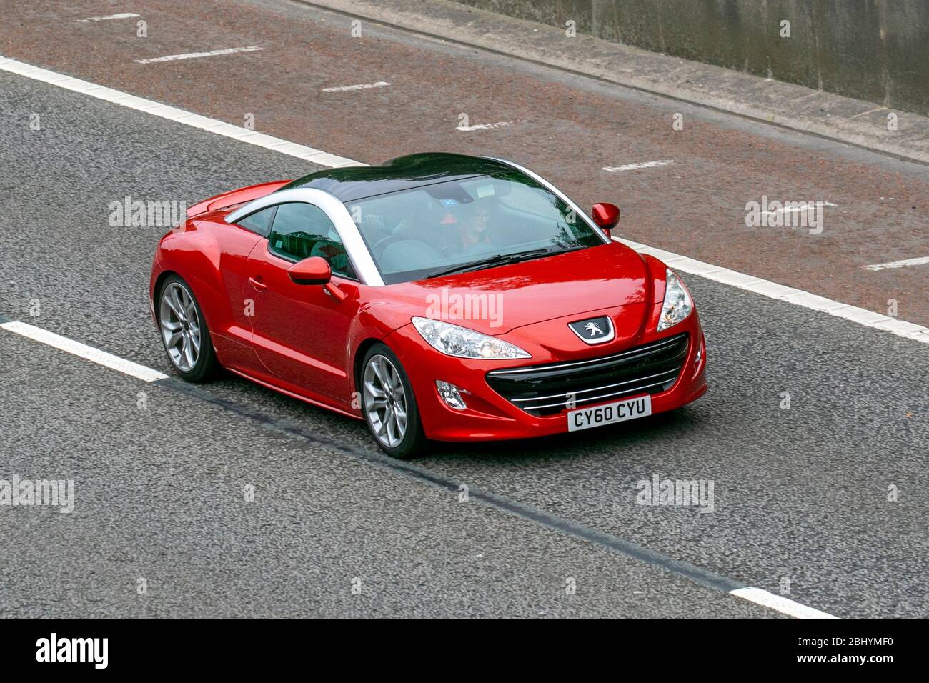2010 Red Peugeot RCZ Coupe; M6, Lancaster, UK; Vehicular traffic ...