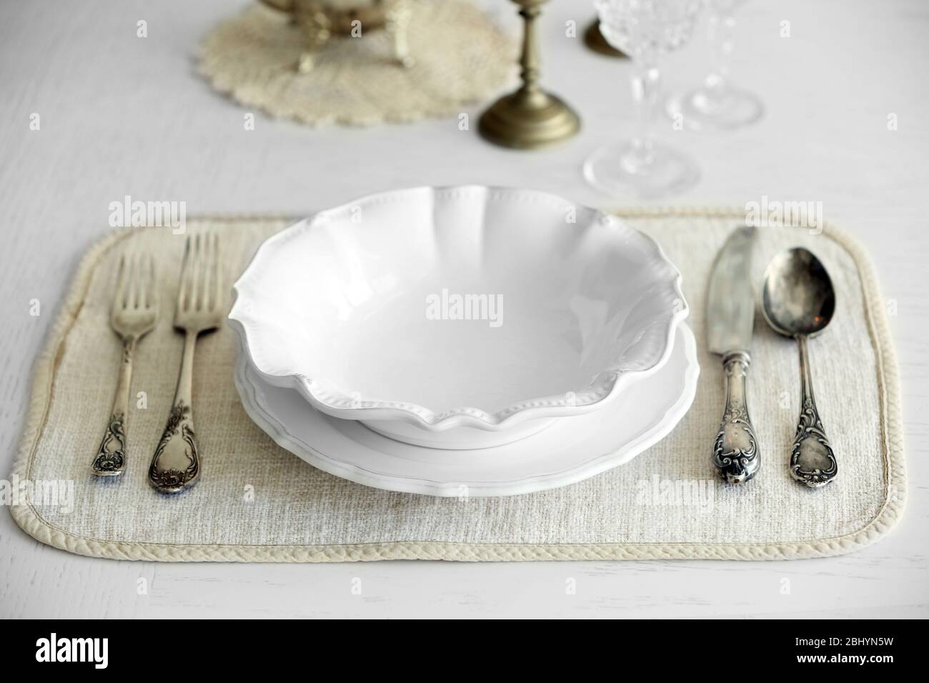 Beautiful table setting with vintage silverware Stock Photo - Alamy