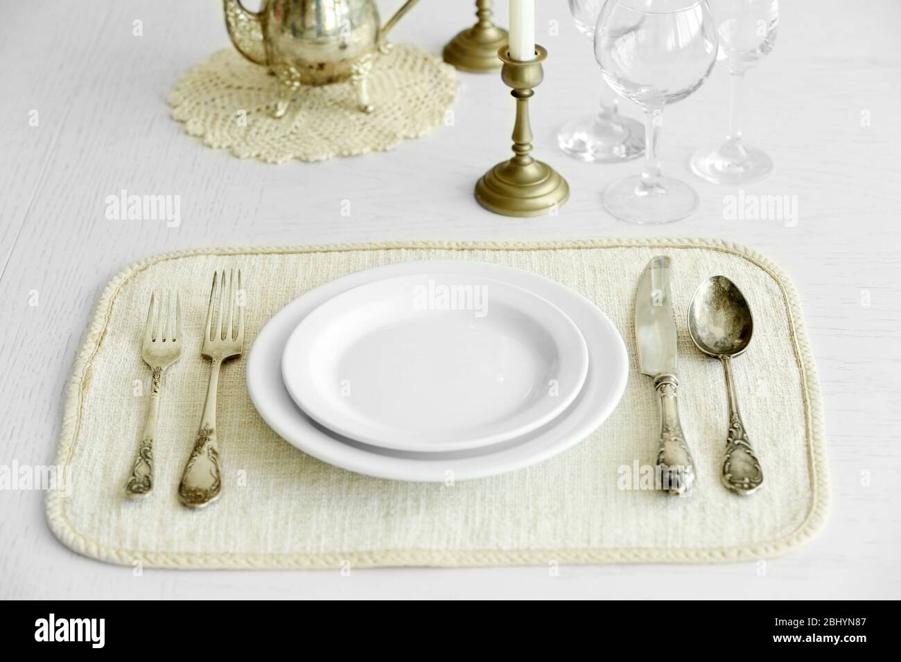 Beautiful table setting with vintage silverware Stock Photo - Alamy