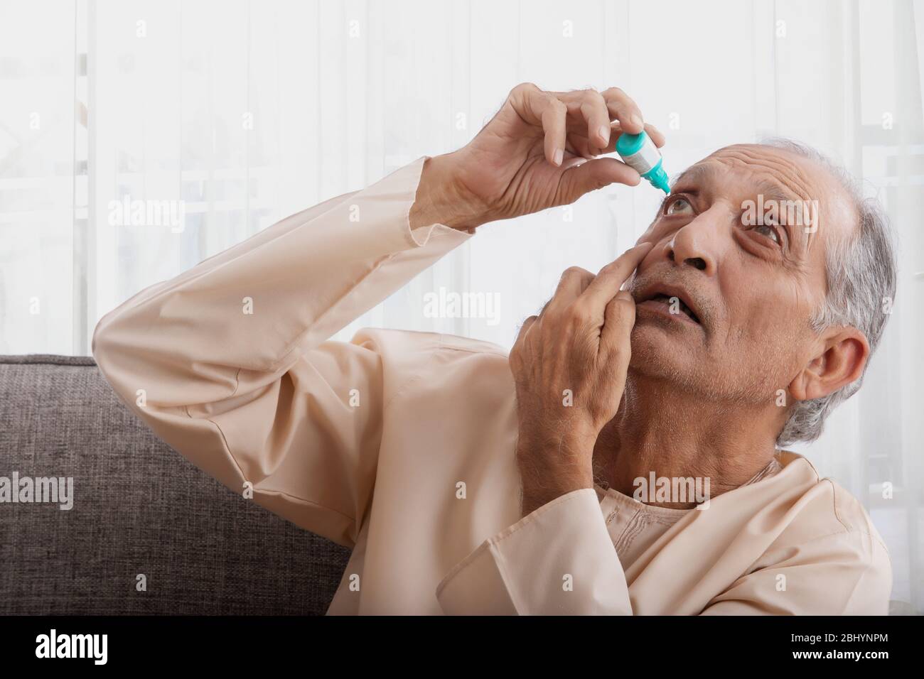 Senior man putting eye drops on his own. (Health and fitness Stock ...