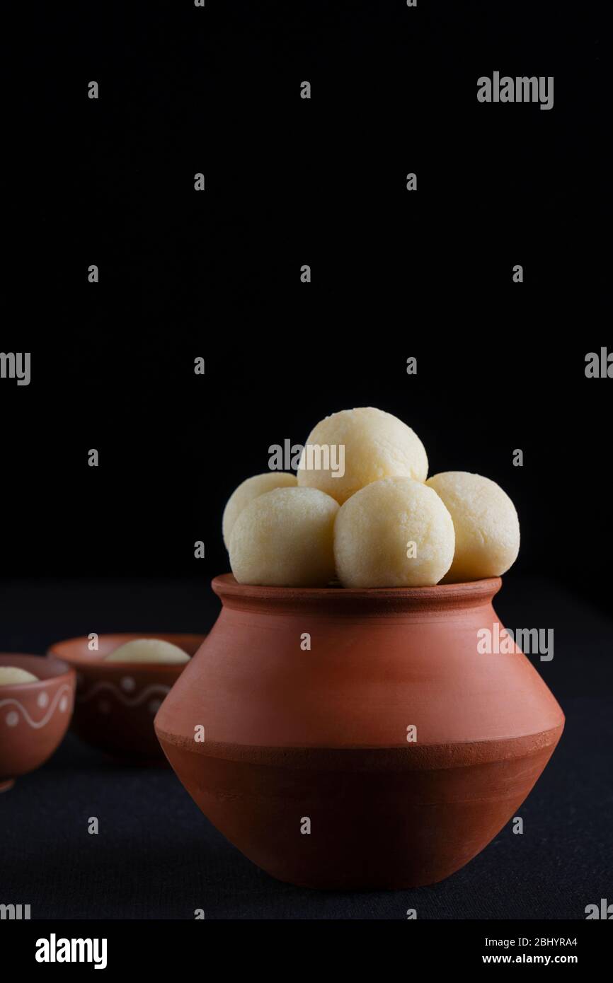 Mouth watering white rasgullas kept in earthen handi and bowls Stock ...