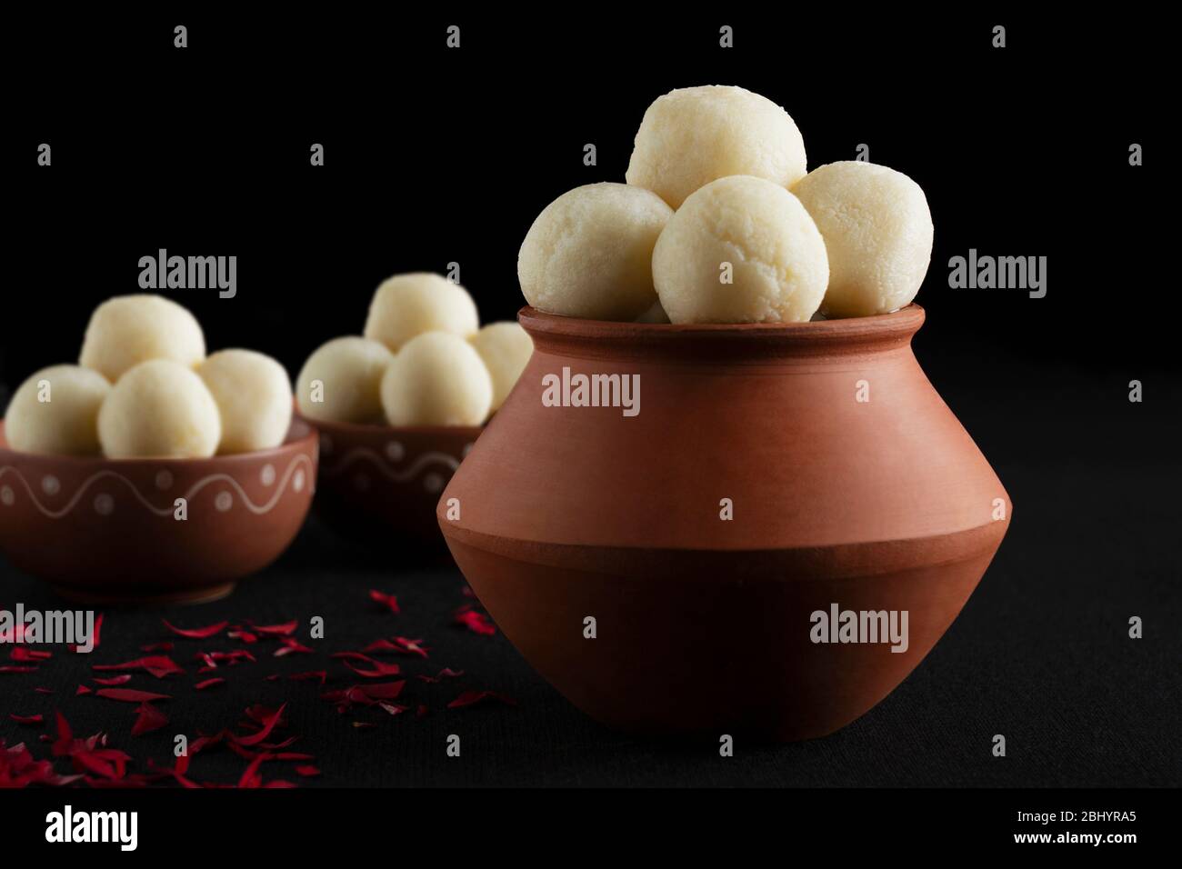 Mouth watering white rasgullas kept in earthen handi and bowls Stock ...