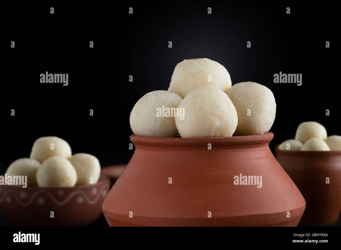 Mouth watering white rasgullas kept in earthen handi and bowls Stock ...