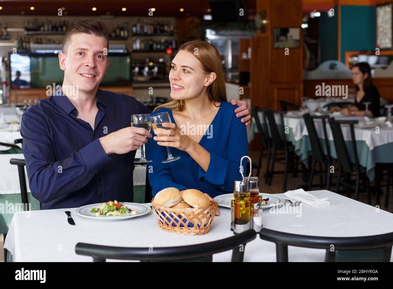 Glad couple spending time in restaurant and having nice talking Stock ...