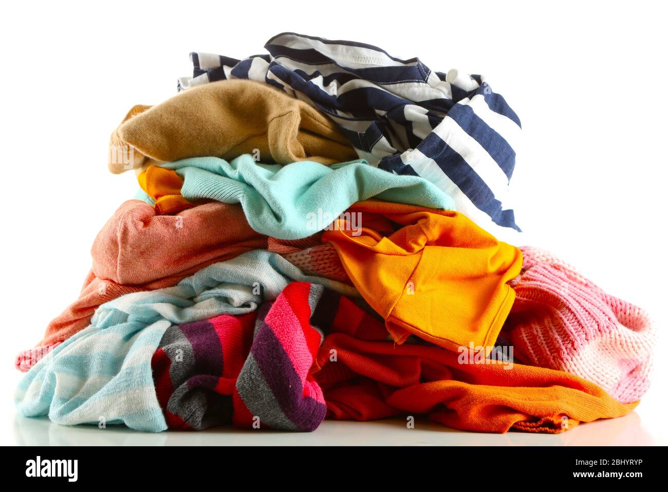 Heap of different clothes, isolated on white Stock Photo - Alamy