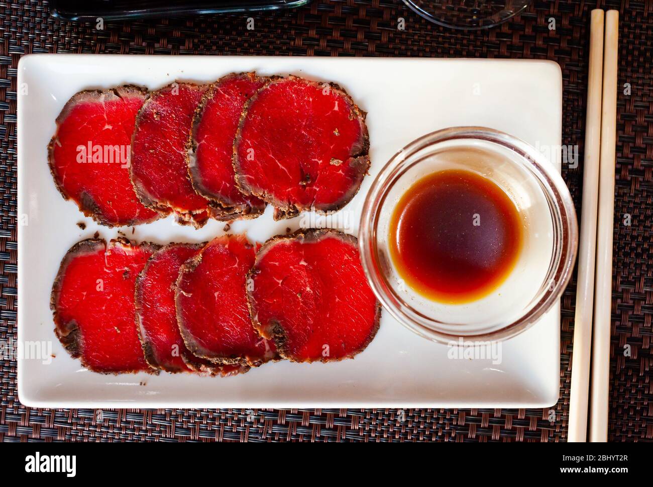 Raw beef sashimi, traditional japanese appetizer Gyusashi Stock Photo ...