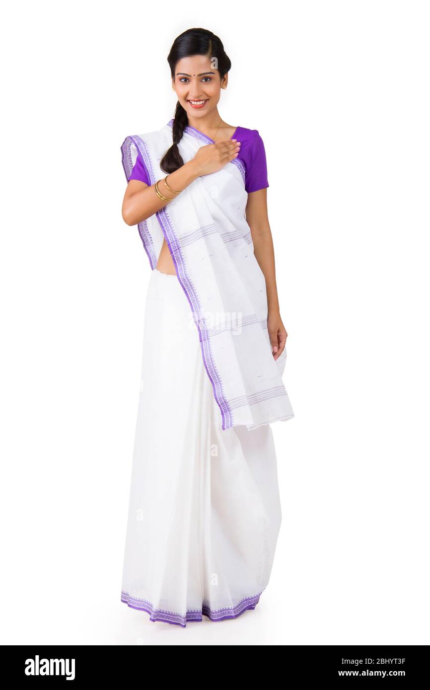 Sales girl posing in a white saree Stock Photo - Alamy