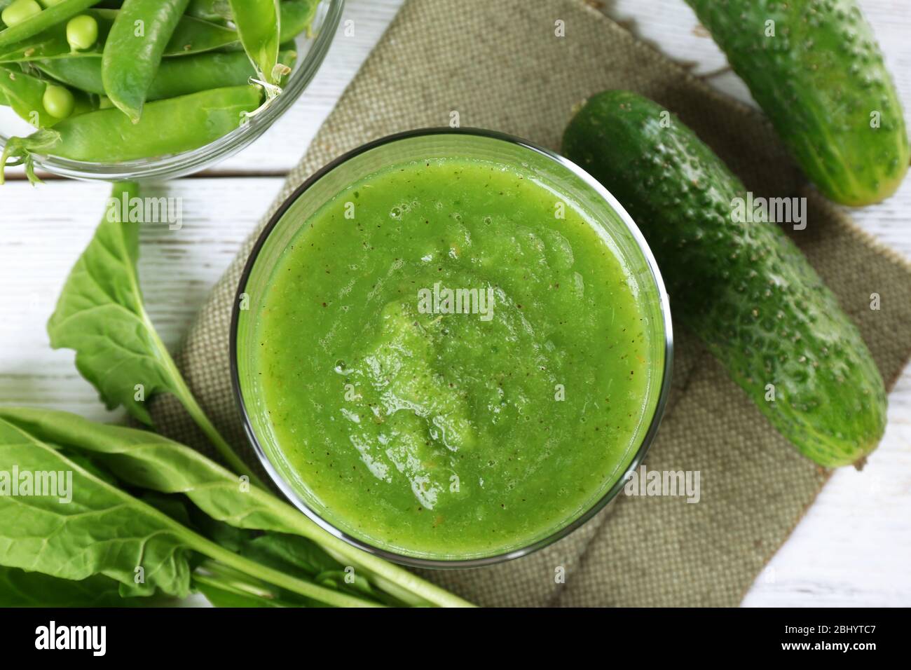 Healthy green smoothie on wooden table, top view Stock Photo - Alamy