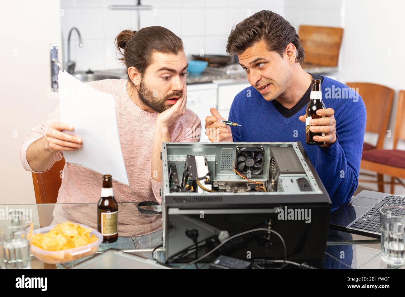 Men drink beer and repair the desktop computer Stock Photo - Alamy