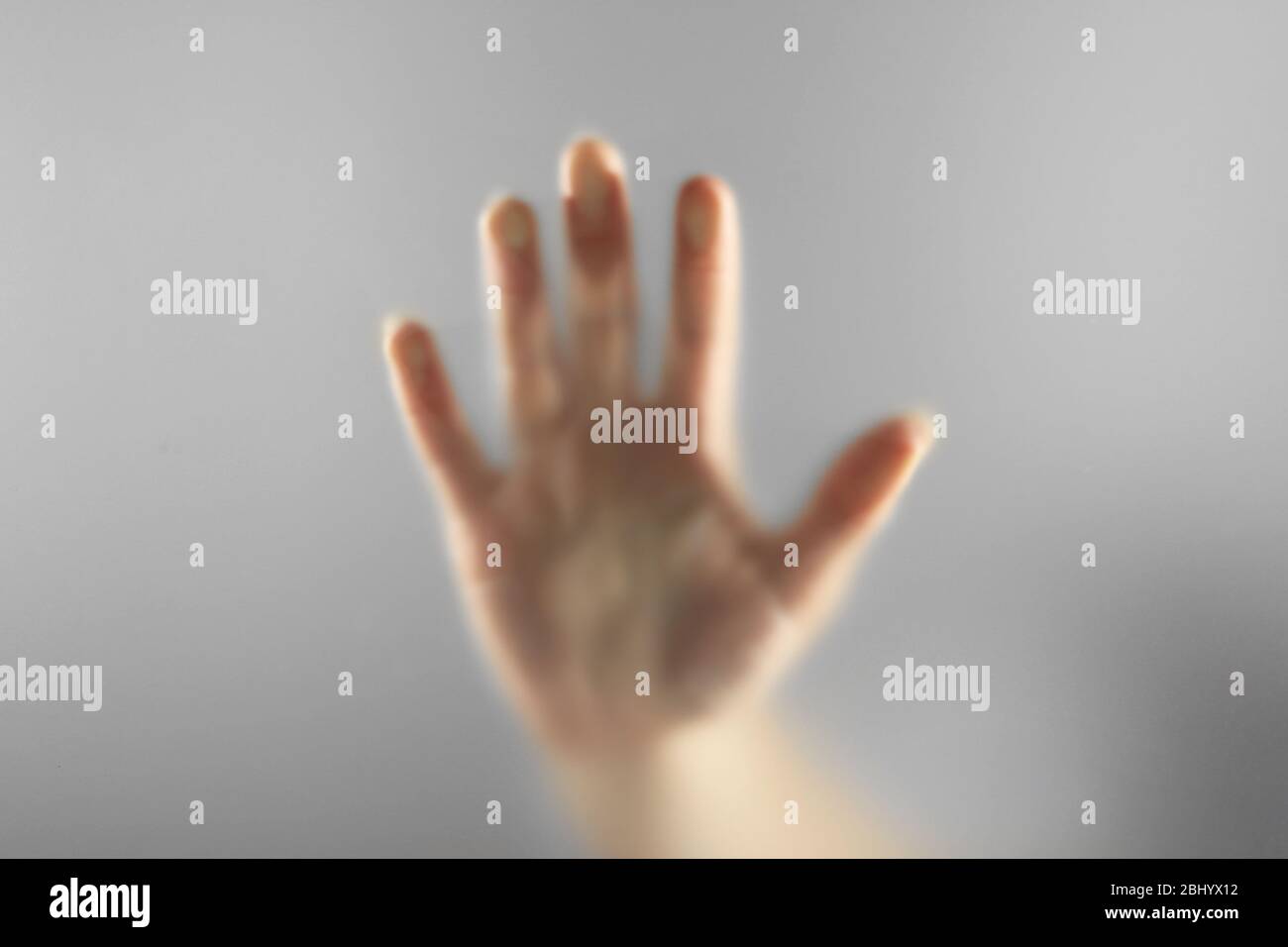 Hand silhouettes behind glass foreground Stock Photo - Alamy