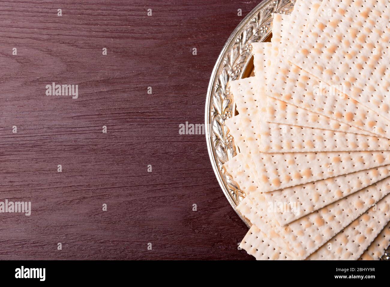 Matzo for Passover on metal tray on table close up Stock Photo - Alamy