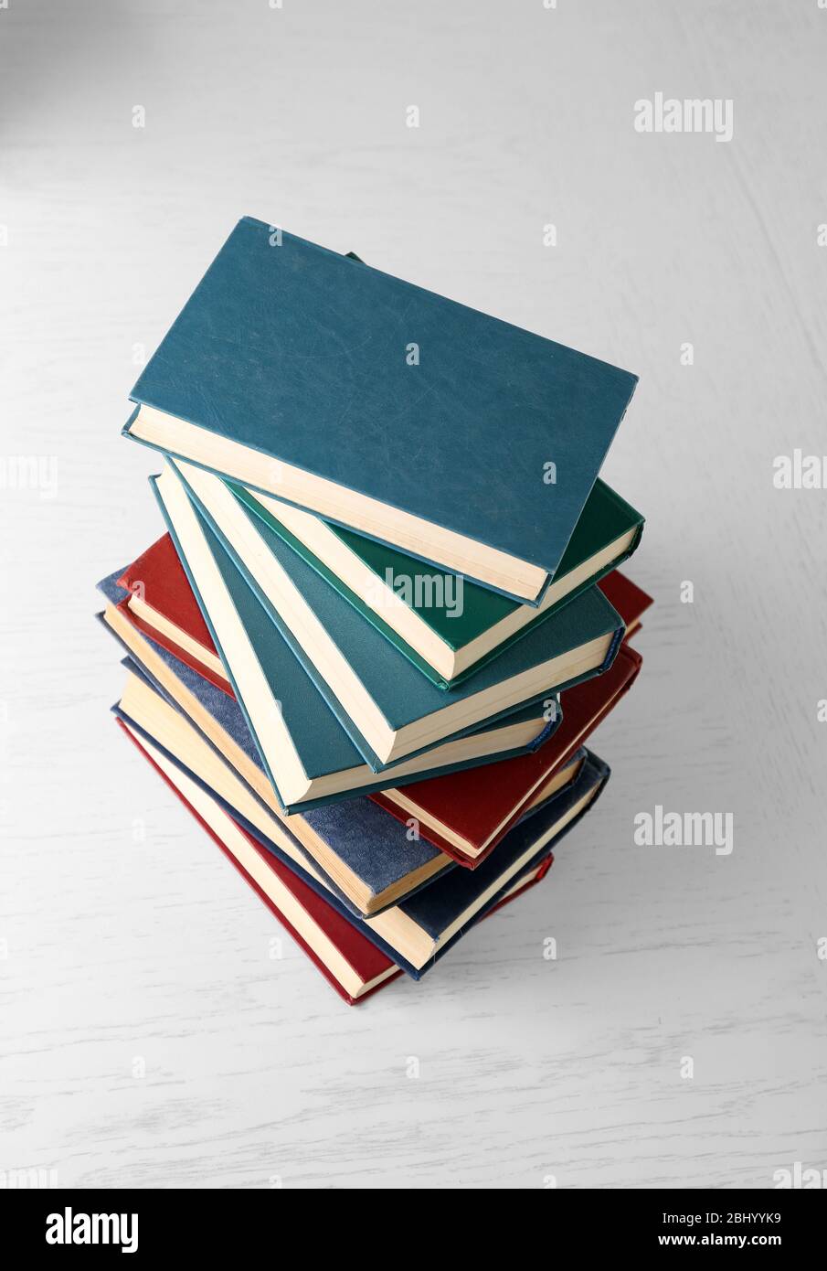 Stack of books on light background Stock Photo - Alamy