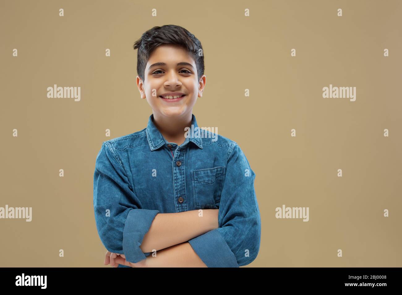 Boy with crossed arms hi-res stock photography and images - Alamy