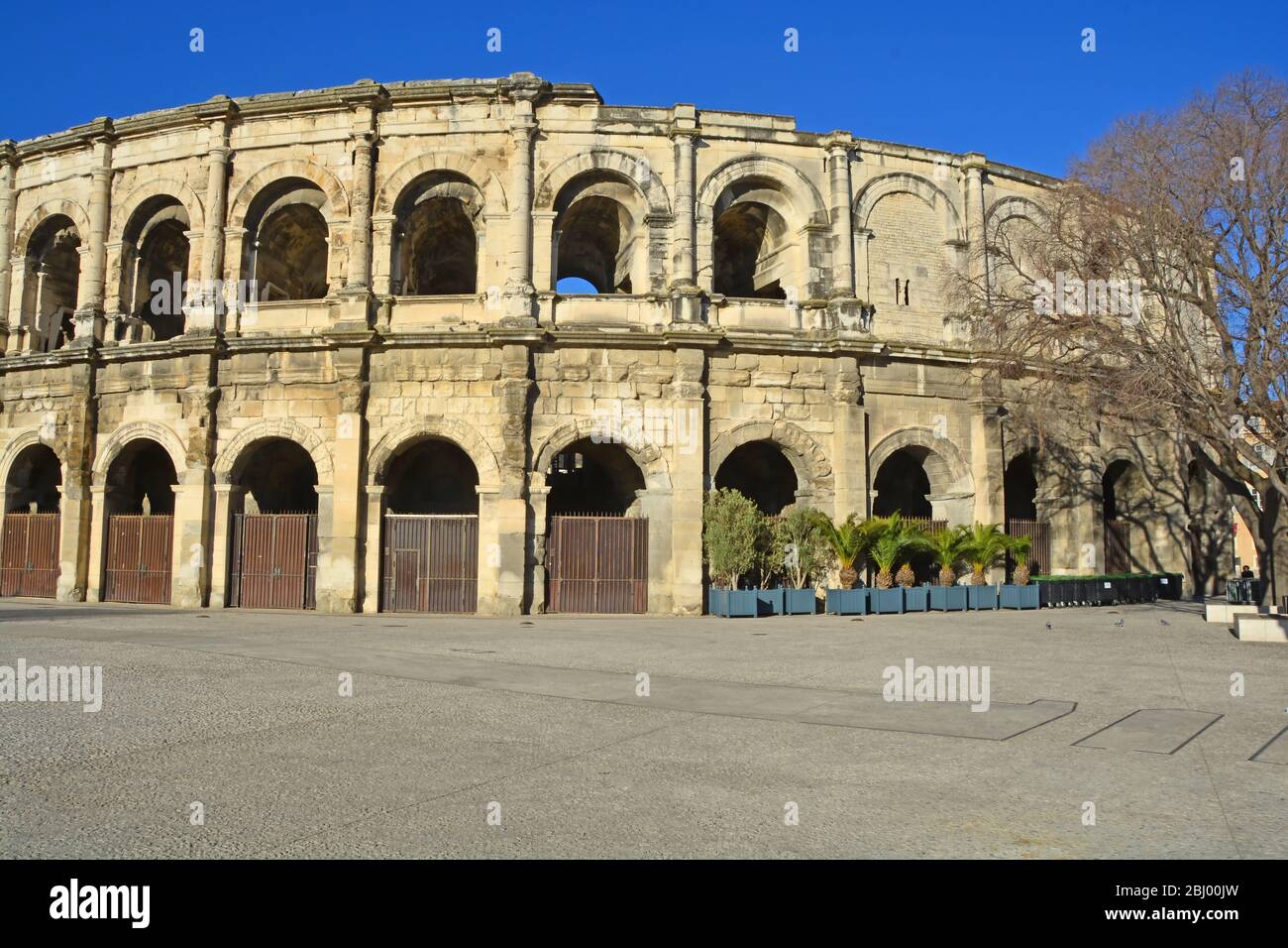 The outer wall of the Ancient Roman Amphitheatre at Nimes in the South ...