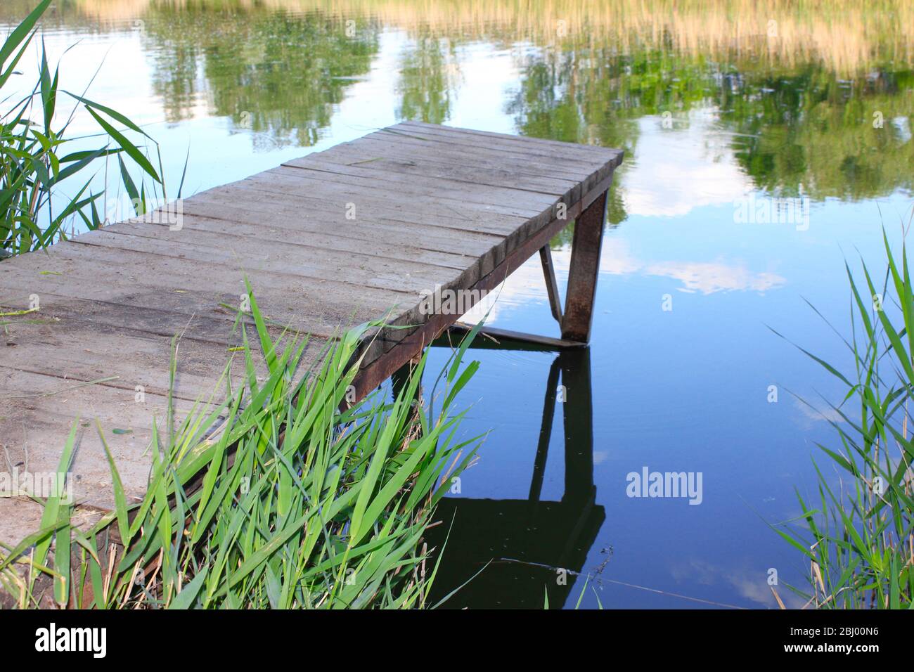 Old wooden jetty at lake Stock Photo - Alamy
