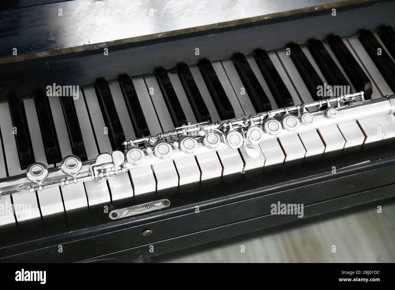 Flute on piano keys, closeup Stock Photo - Alamy
