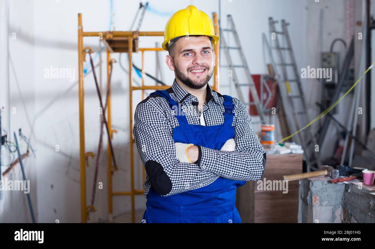Portrait of builder which is doing repair at home Stock Photo - Alamy