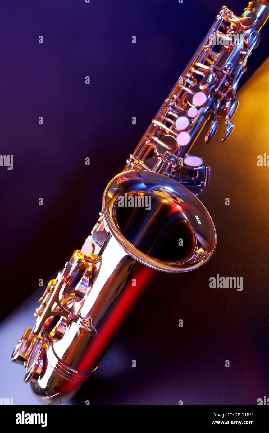 Golden saxophone on purple background Stock Photo - Alamy