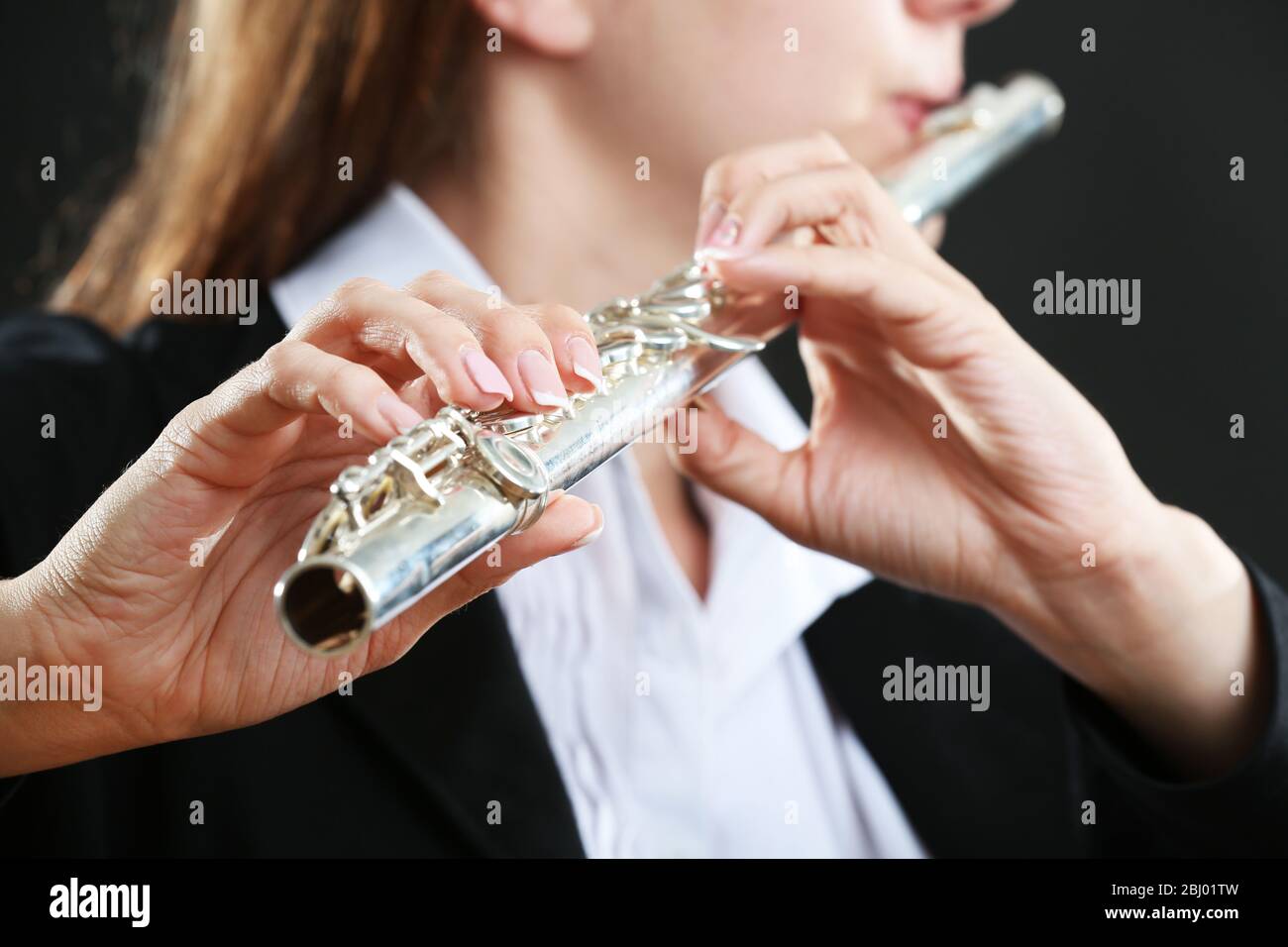 Musician playing flute, closeup Stock Photo - Alamy