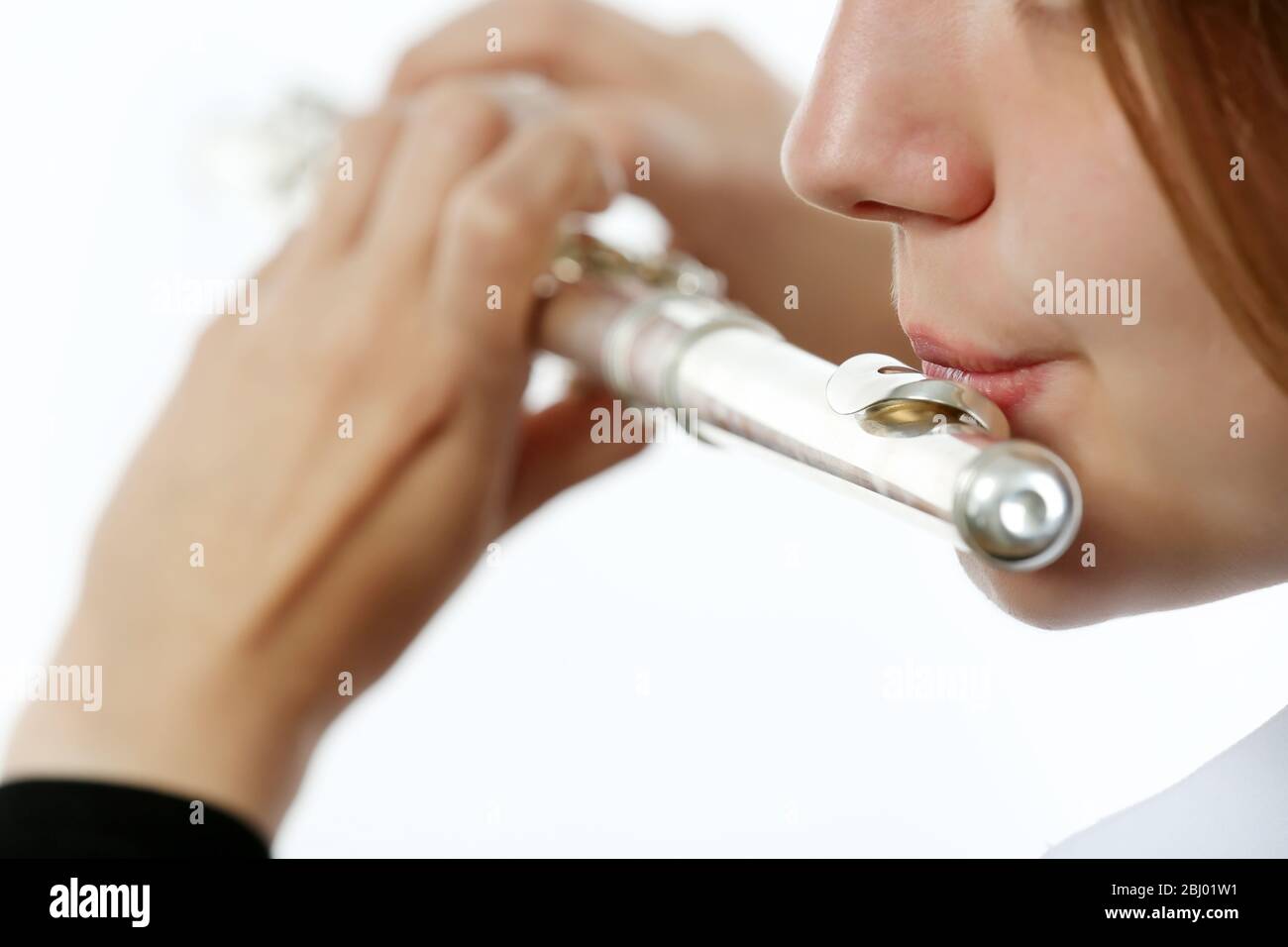 Musician playing flute isolated on white Stock Photo - Alamy