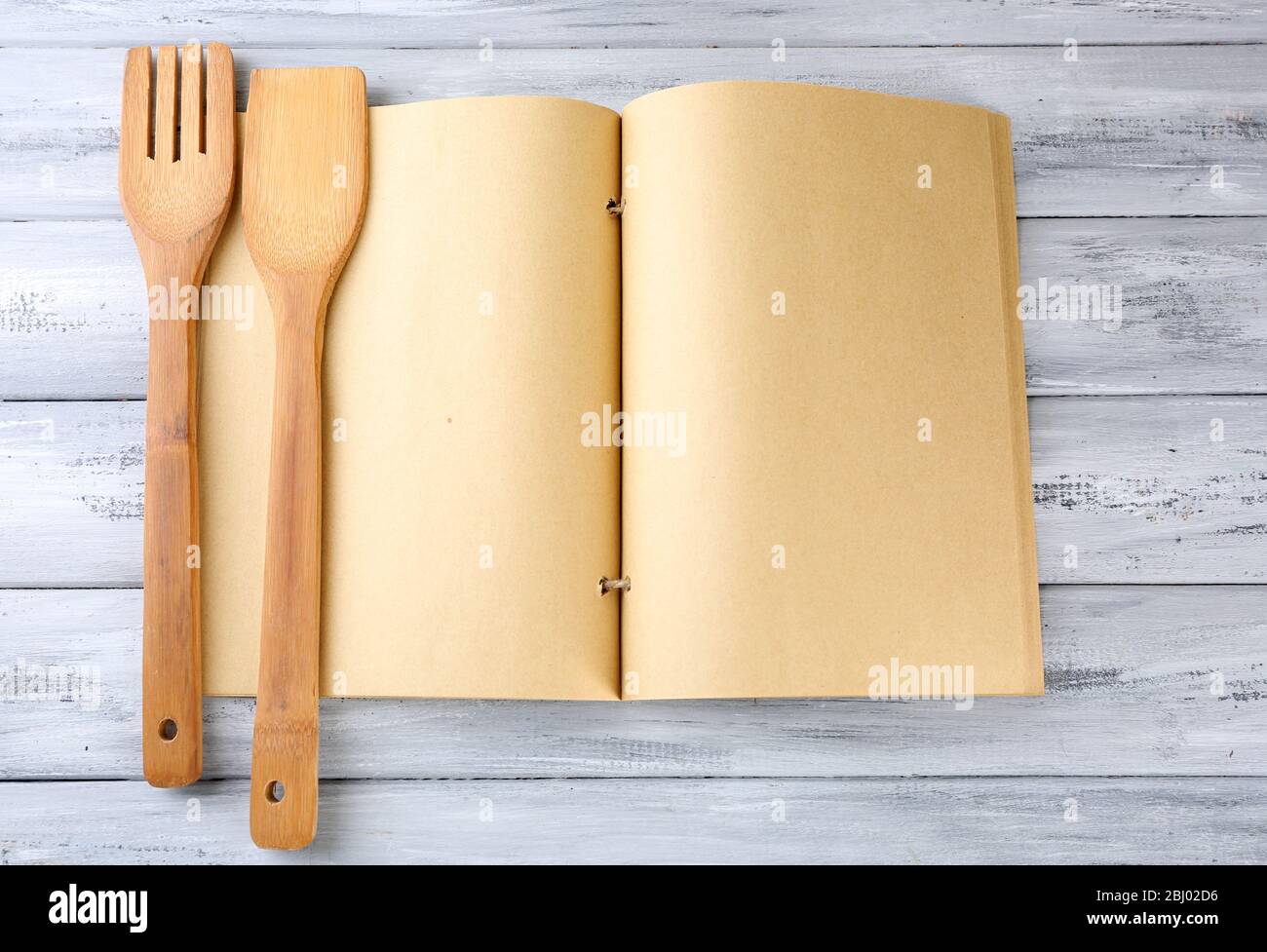 Open recipe book on wooden background Stock Photo - Alamy