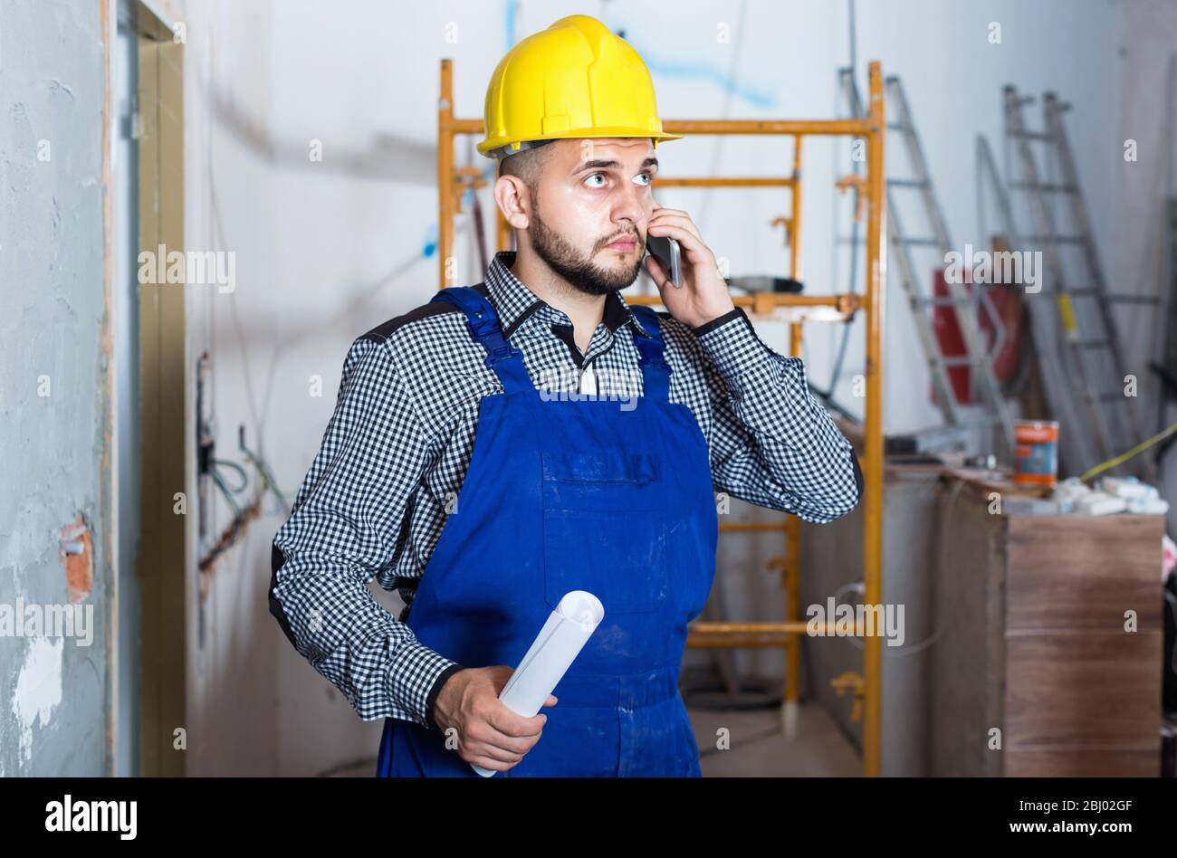Diligent male worker is clarifying details of work from client Stock ...