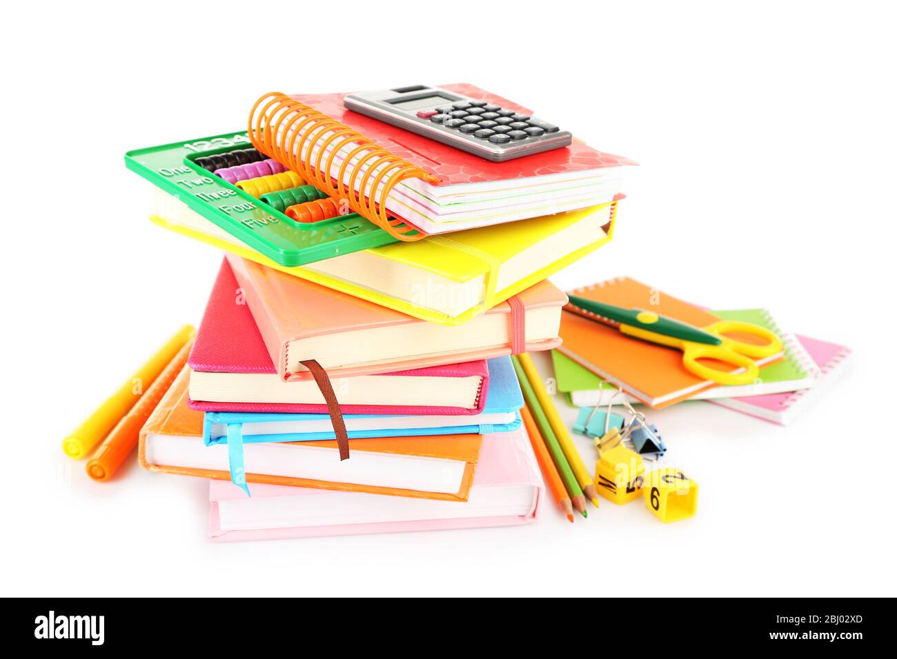 Stack of books and stationery isolated on white Stock Photo - Alamy