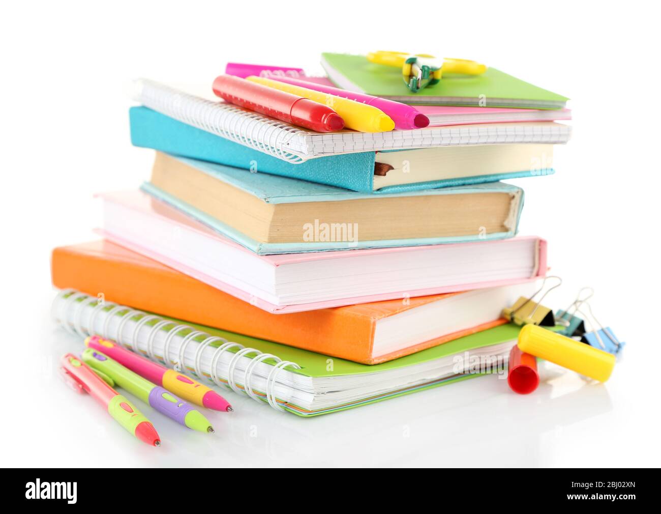 Stack of books and stationery isolated on white Stock Photo - Alamy