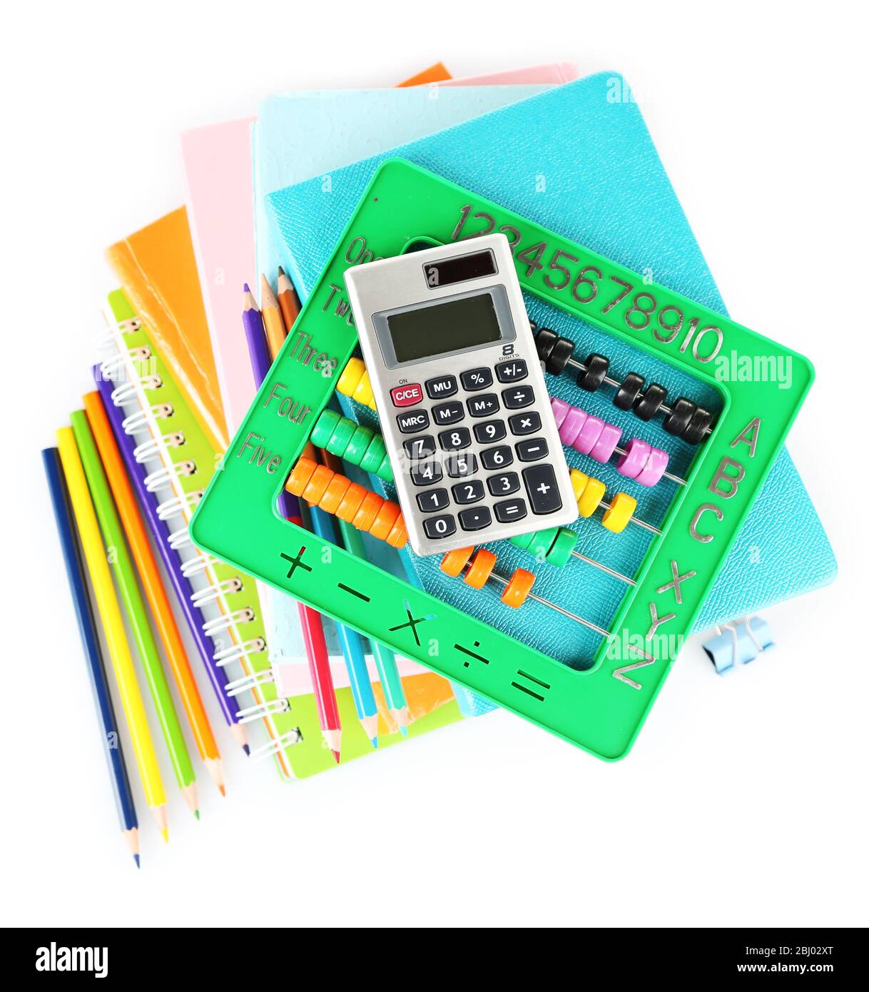 Stack of books and stationery isolated on white Stock Photo - Alamy