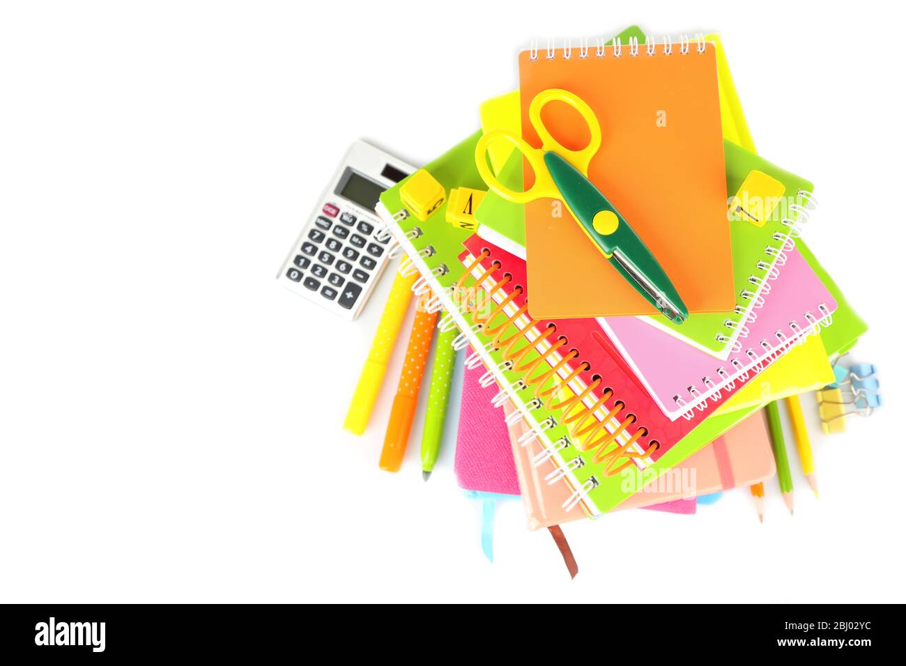 Stack of books and stationery isolated on white Stock Photo - Alamy