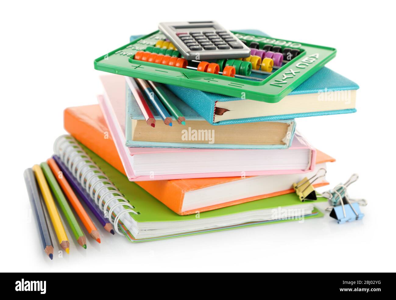 Stack of books and stationery isolated on white Stock Photo - Alamy