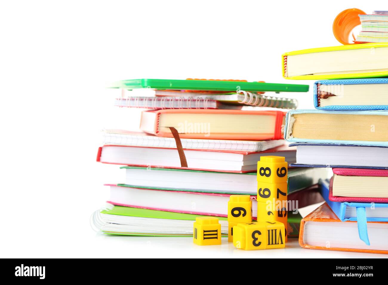 Stack of books and stationery isolated on white Stock Photo - Alamy