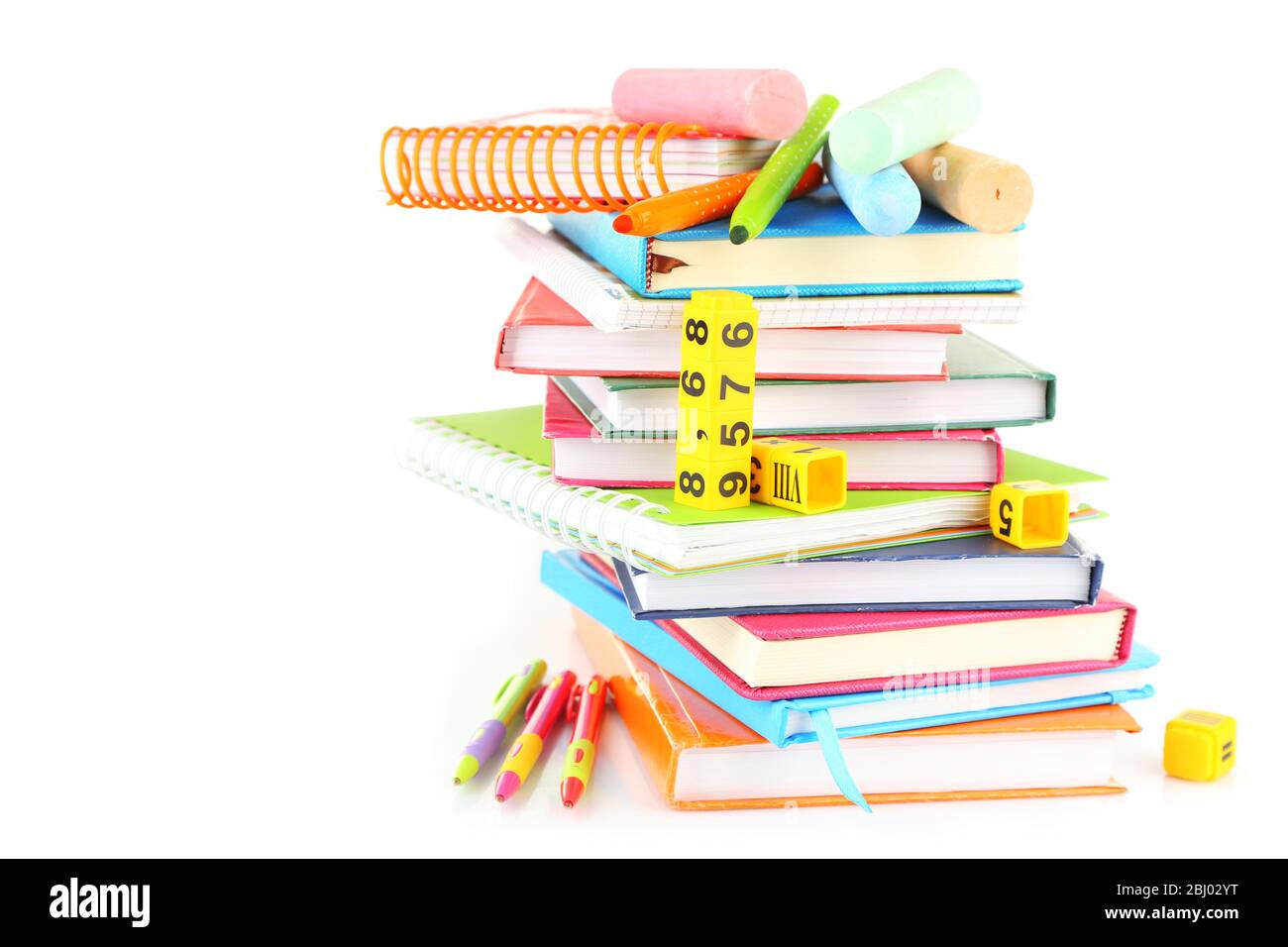 Stack of books and stationery isolated on white Stock Photo - Alamy