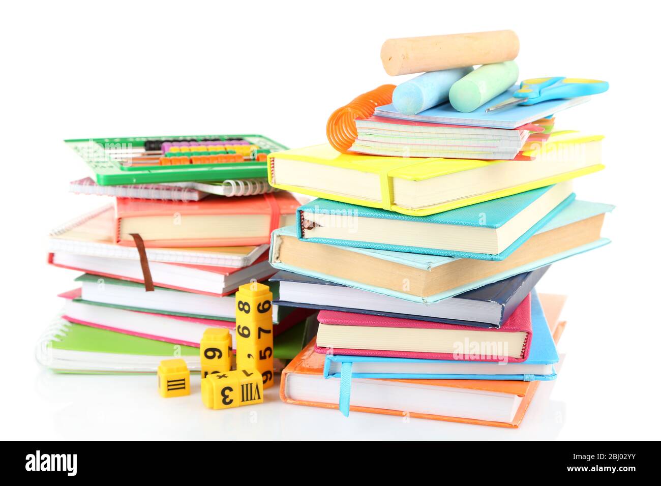Stack of books and stationery isolated on white Stock Photo - Alamy