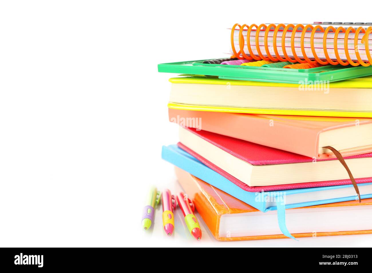 Stack of books and stationery isolated on white Stock Photo - Alamy