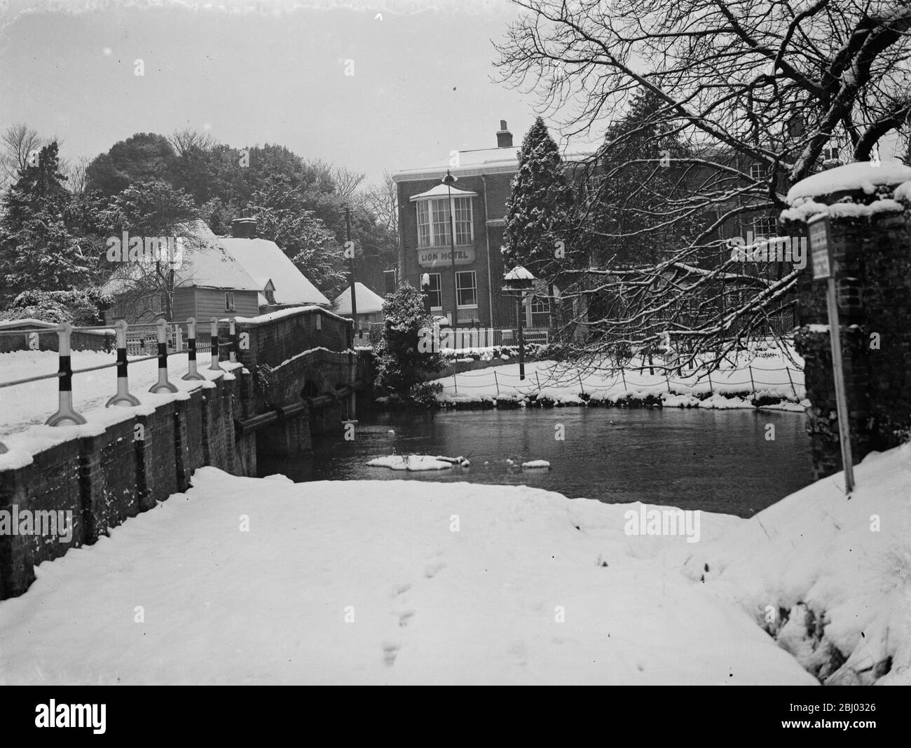 The Lion pub in Farningham , Kent , viewed from over the river Darent ...