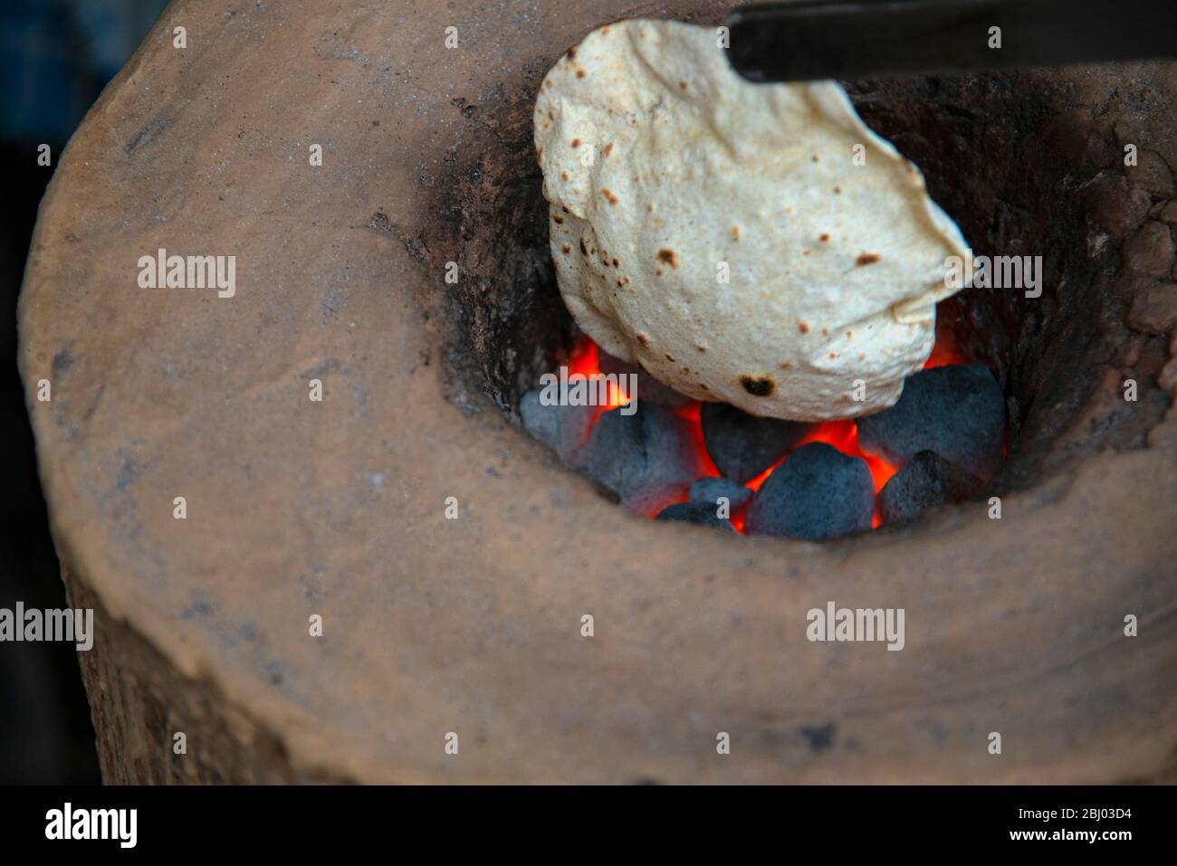 Fresh tandoori roti baked in oven Stock Photo - Alamy